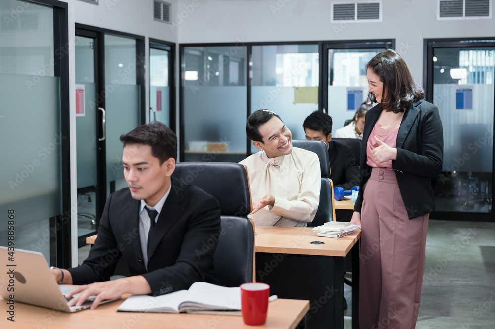 Asian female manager thumb up praising and congratulating with gay ...