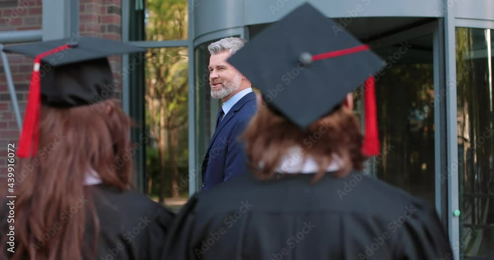 Full length view of the group of student people wearing graduation ...