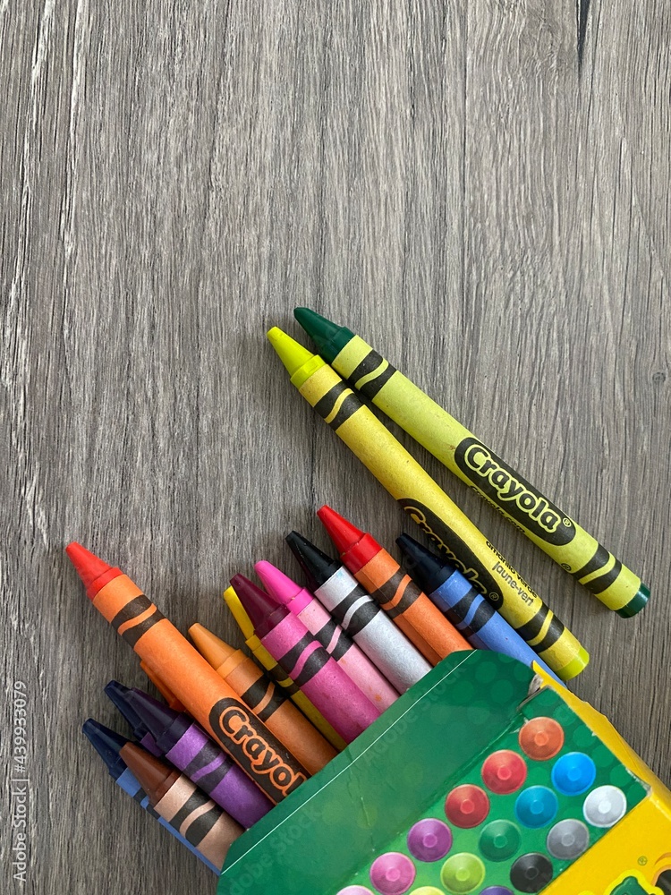 New Crayola crayons on a gray wooden background table stock photo ...