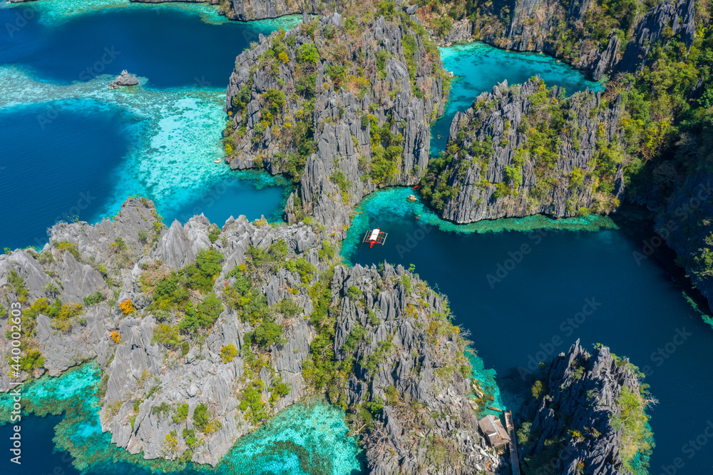 Aerial view of turquoise tropical lagoon with limestone cliffs in Coron ...
