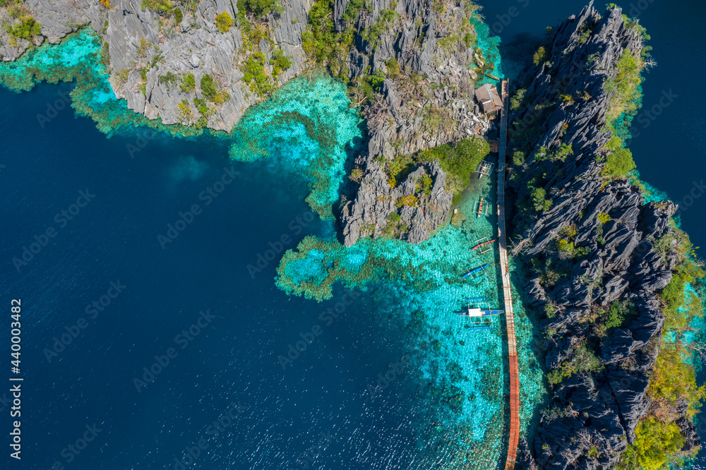 Aerial view of turquoise tropical lagoon with limestone cliffs in Coron ...