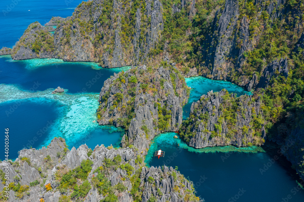 Aerial view of turquoise tropical lagoon with limestone cliffs in Coron ...