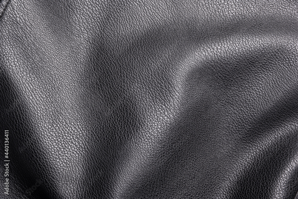 Closeup of black heavy leather material with deep texture, highlights ...