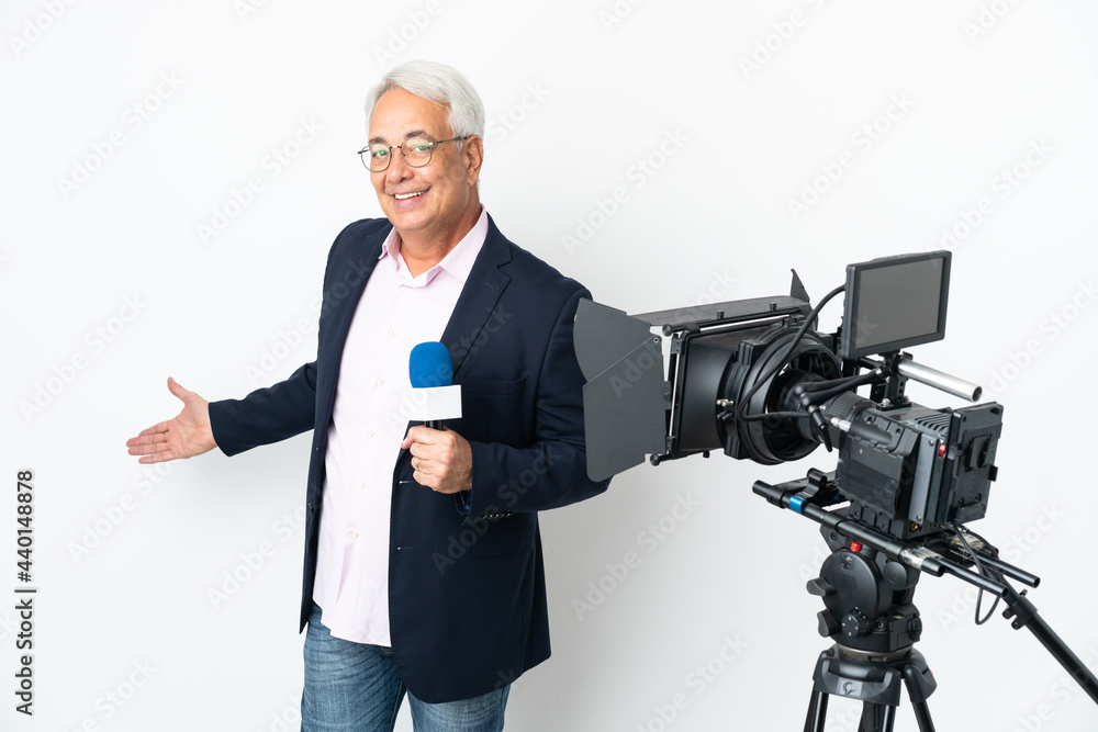 Reporter Middle age Brazilian man holding a microphone and reporting ...
