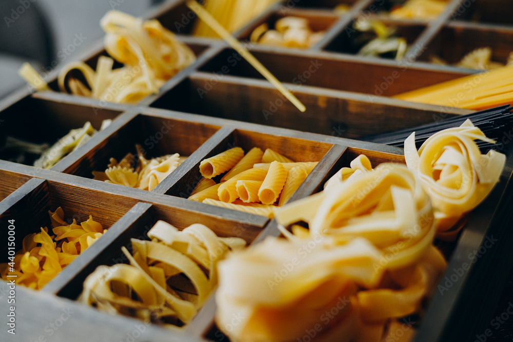 Different types of pasta in a box. Pasta of durum wheat in a box ...