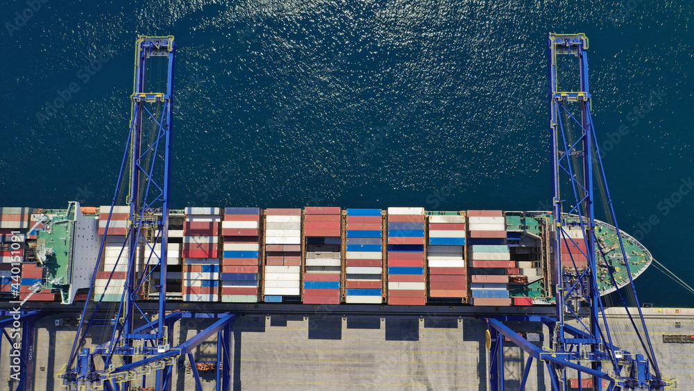 Aerial drone top down photo of industrial cargo container ship loading ...