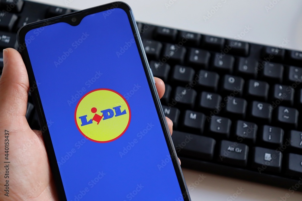 Bahia, Brazil - December 1, 2020. Person holding smartphone with Lidl ...