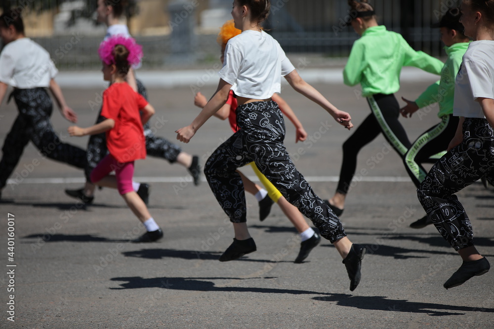 Running group of young athletes students children little girl and boys ...