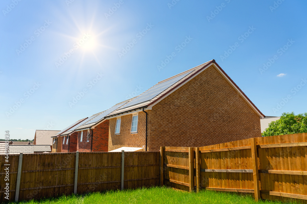 Houses with solar panels capture sun light. English architecture Stock ...