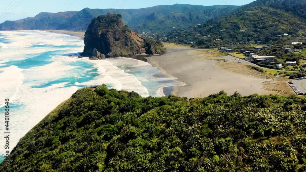 Establishing shot of Piha Beach, famous spot for outdoor activities in ...