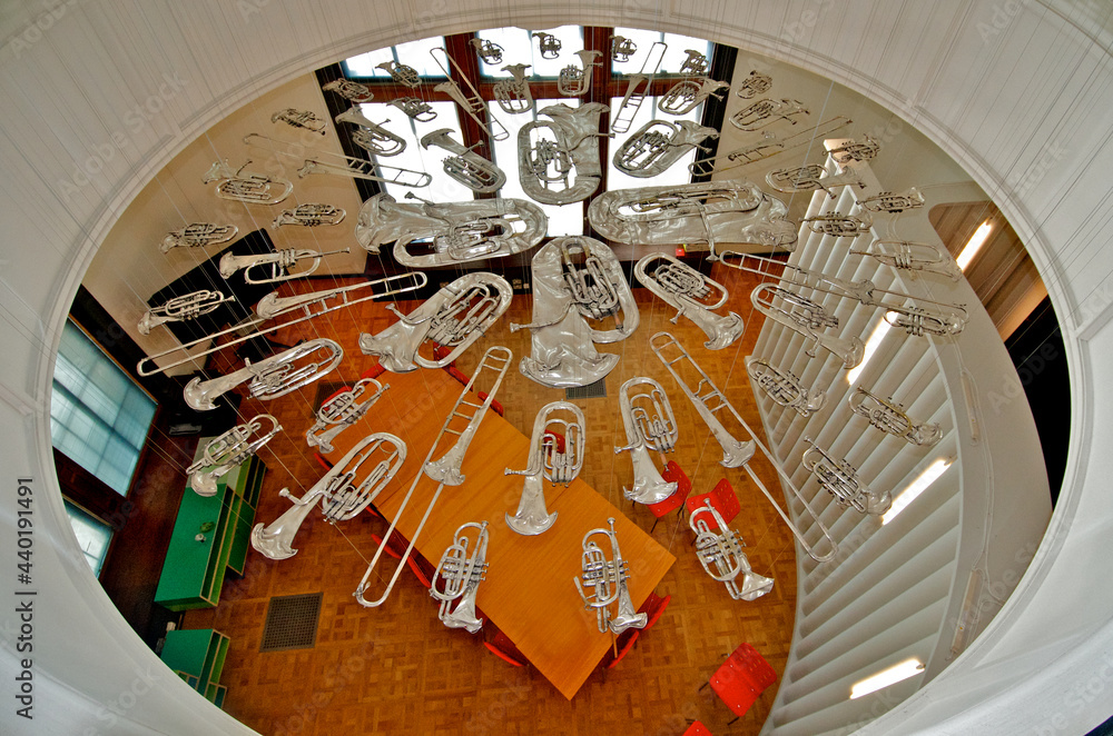 Art installation of flattened “silver” instruments called “Breathless ...