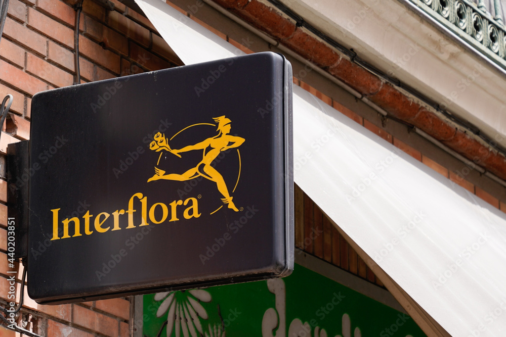 Interflora logo text and brand sign boutique of shop flowers and ...