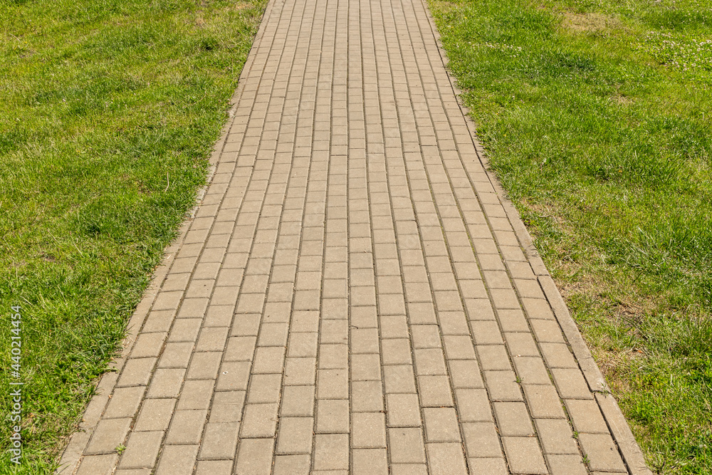Footpath with grass texture background, paved path pattern Stock Photo ...