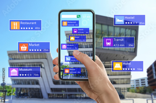 Tourist using online guide application on smartphone for navigation in ... Tourist using online guide application on smartphone for navigation in ...