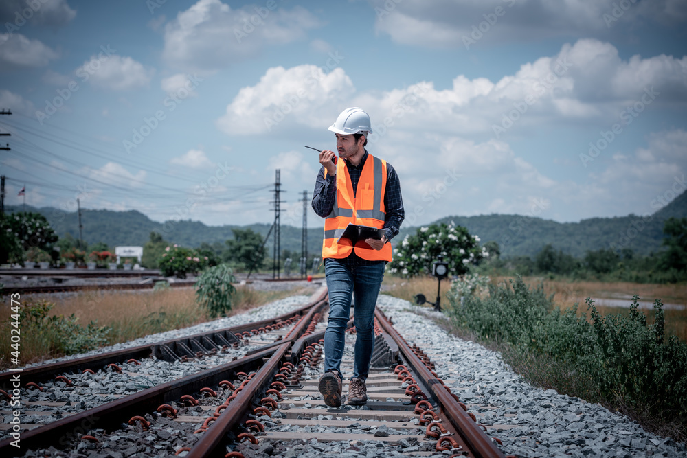 Engineer under inspection and checking construction process railway ...