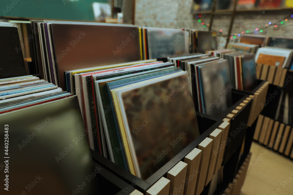 Rack with different vinyl records in store Stock Photo | Adobe Stock