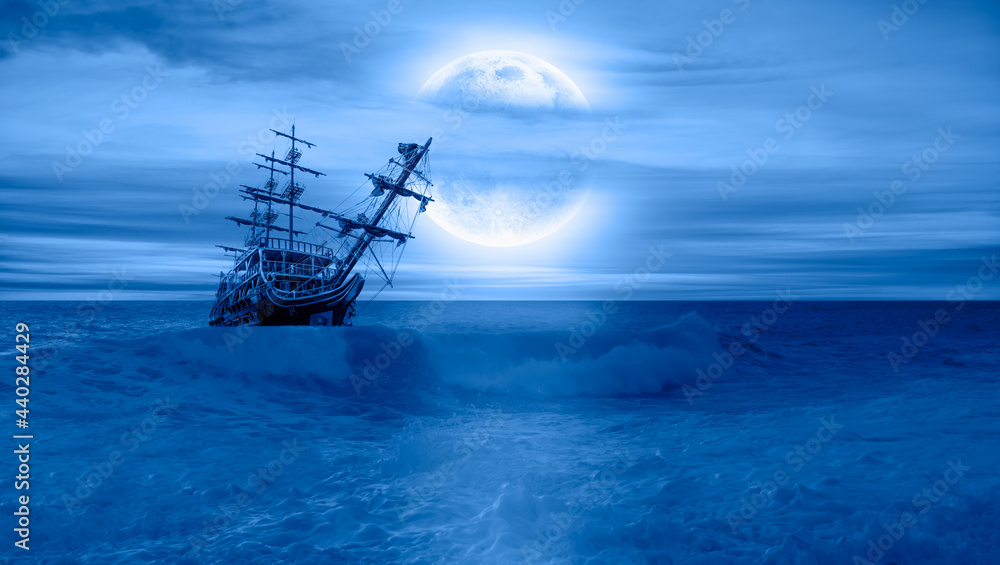 Sailing old ship in storm sea - Night sky with moon in the clouds ...