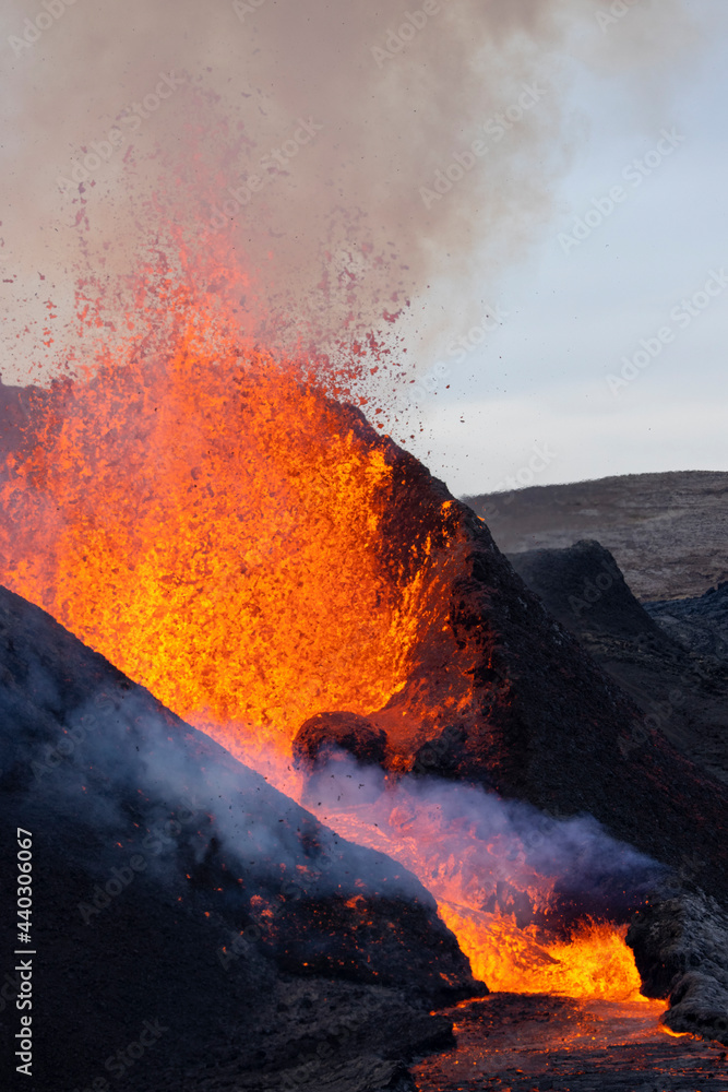 Volcano bursting with hot lava Stock Photo | Adobe Stock
