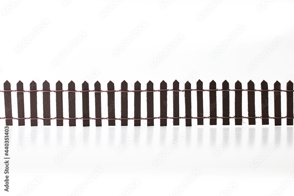 Building wall, fence , or obstacle. Miniature picket fence isolated on ...