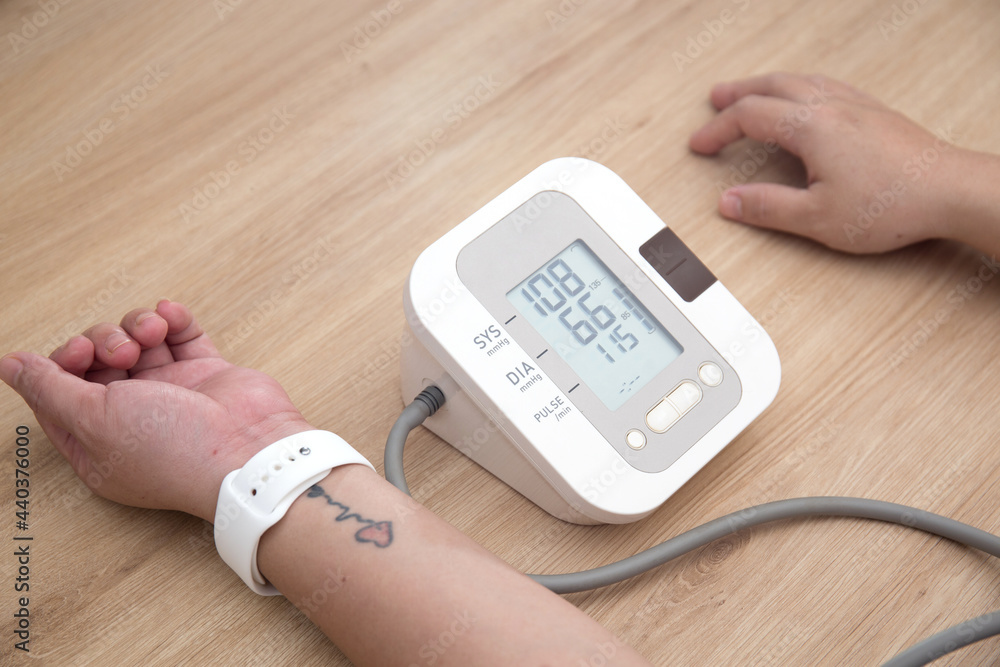 Female Blood Pressure and Heart Rate With Digital Pressure Gauge Female Blood Pressure and Heart Rate With Digital Pressure Gauge