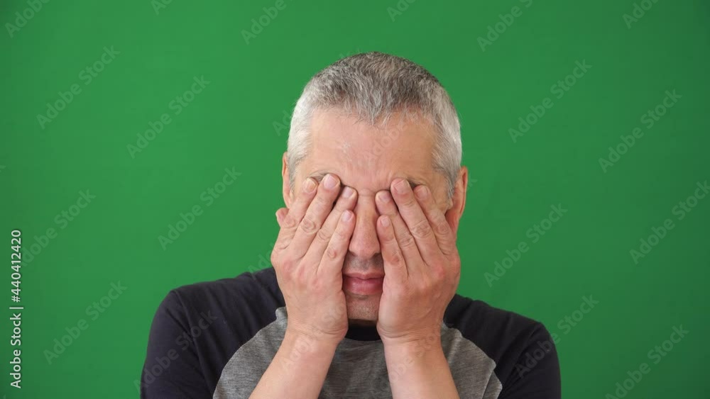 Fatigue in the human face. A mature adult man of European descent with ...