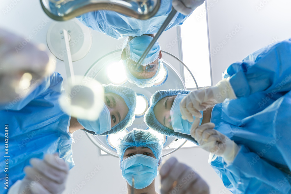 Medical Team Performing Surgical Operation in hospital operating ...