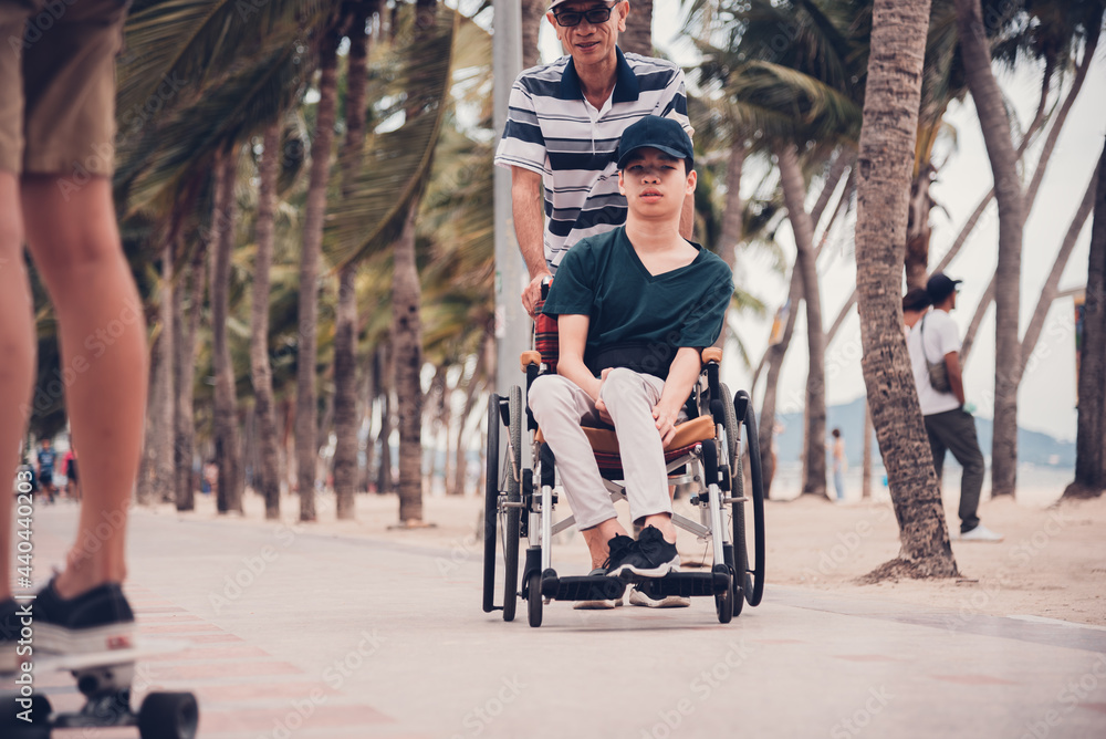Disabled child smile face with activity outdoor on the street in front ...