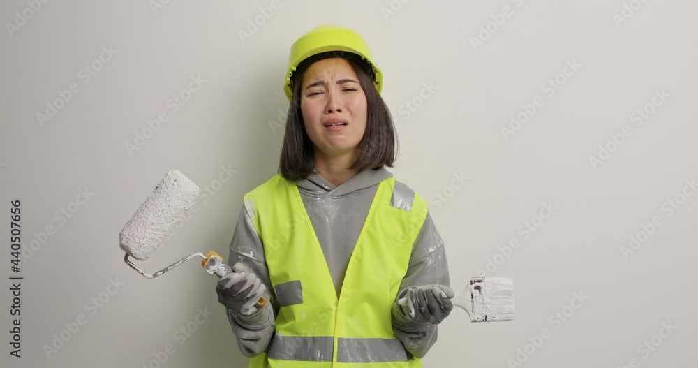 Frustrated Asian female construction worker feels upset as doesnt want ...