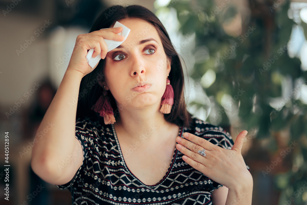 Woman Feeling Hot During Summer Wiping Her Forehead Stock Photo | Adobe ...