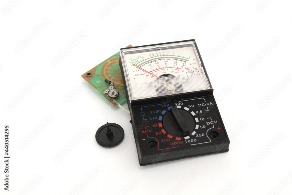 Broken analog multimeter and circuit board isolated on white background ...