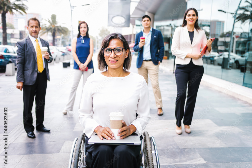 Latin disabled transgender female and her business teamwork taking ...