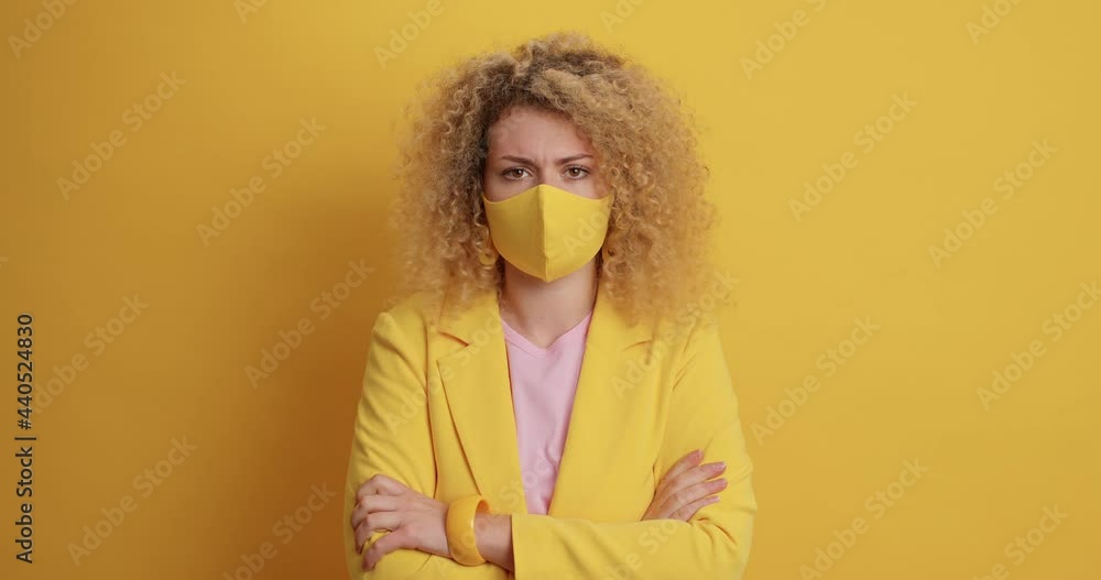 Outraged curly haired woman crosses fingers has angry face looks ...