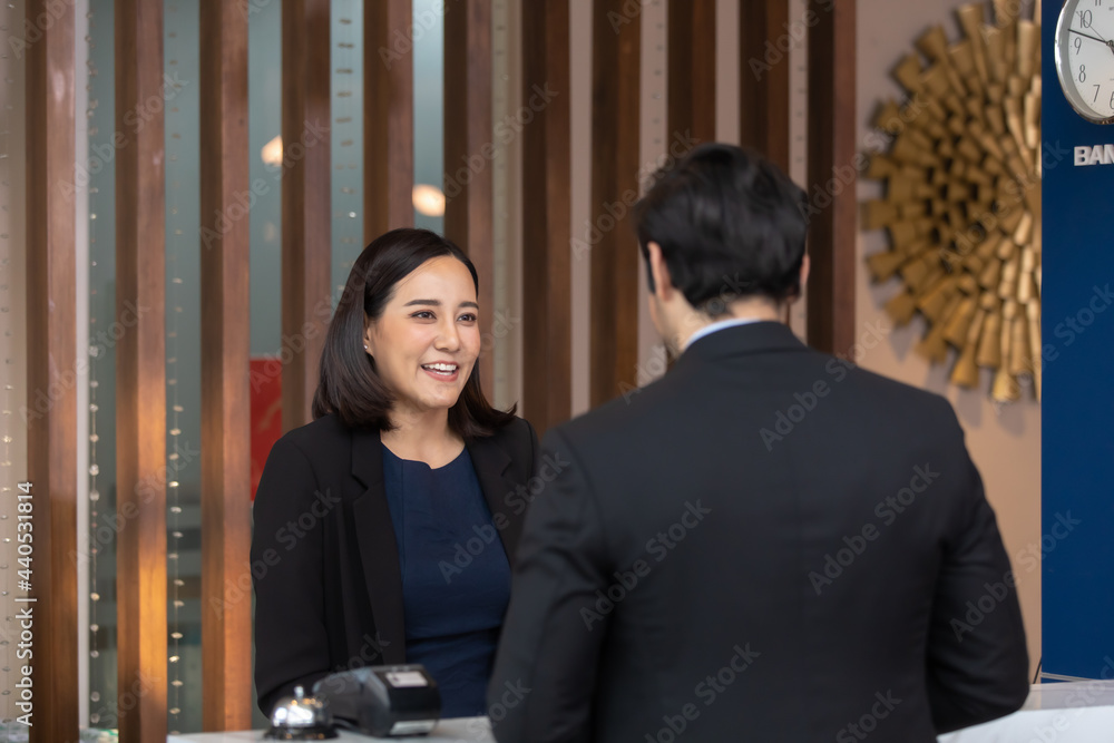 beautiful young asian woman receptionists working at a reception desk ...