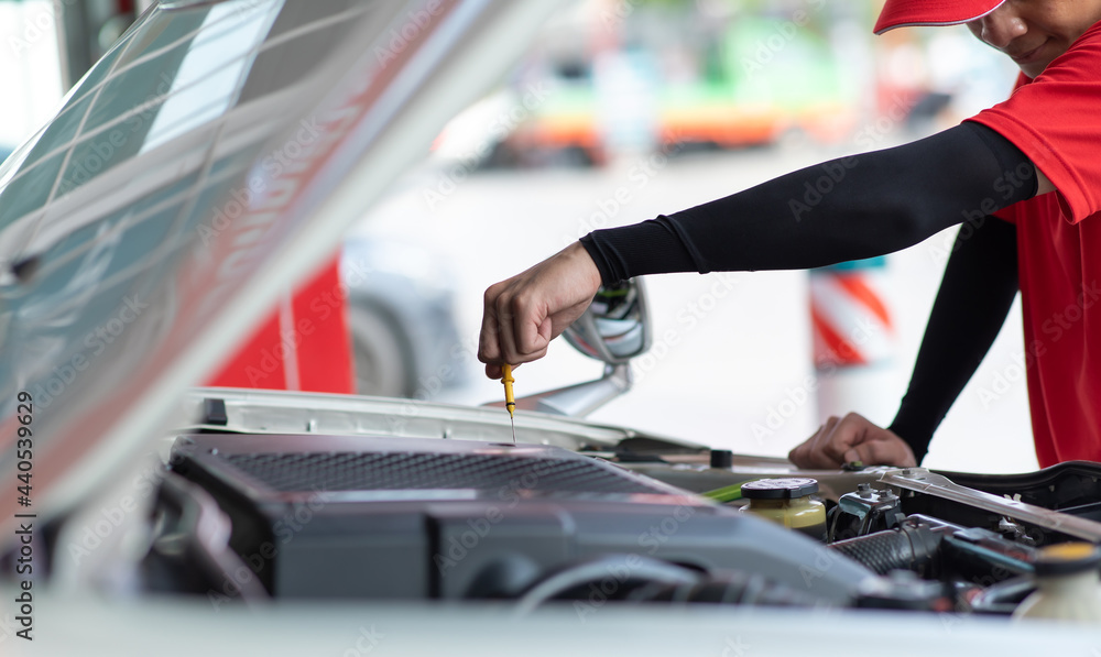 Professional car mechanic checking and maintenance service in gas ...