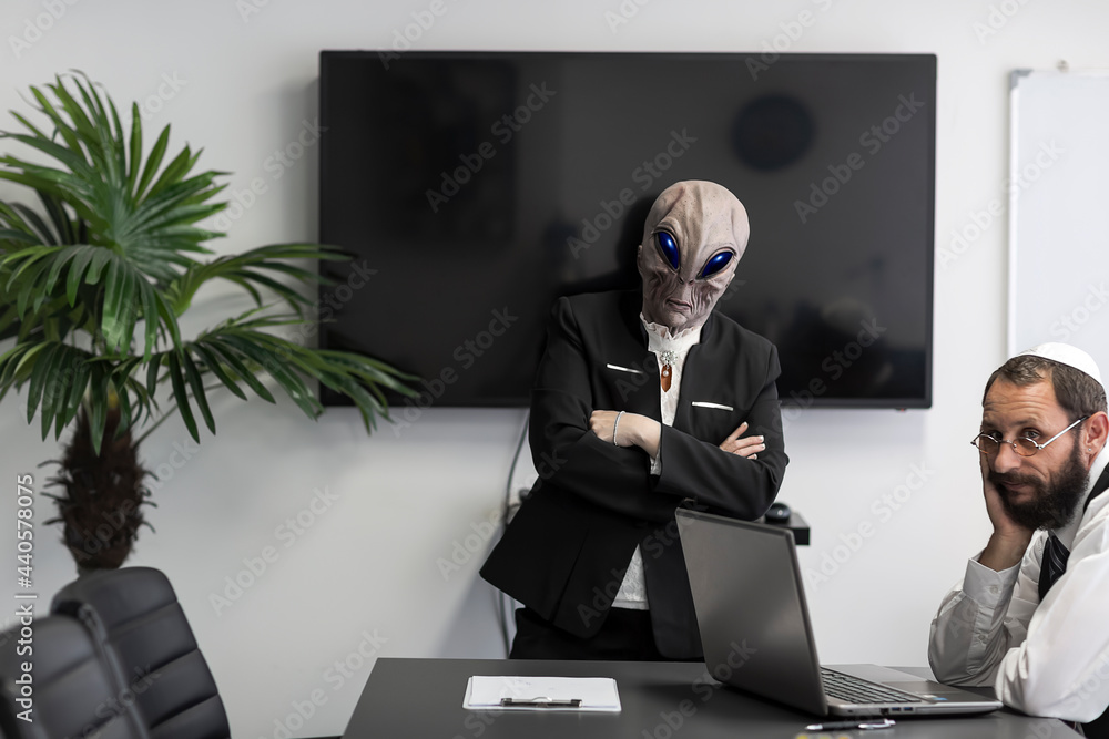 Ufo, Alien business woman looking at camera in the office trying to ...