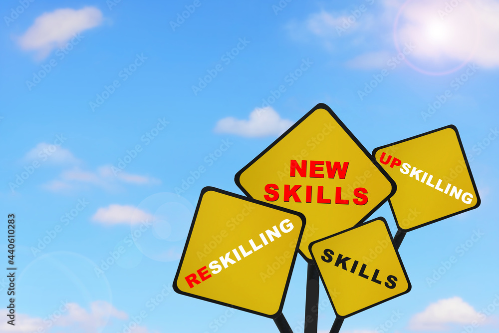 New skills, upskilling, reskilling and skills written on road sign on ...