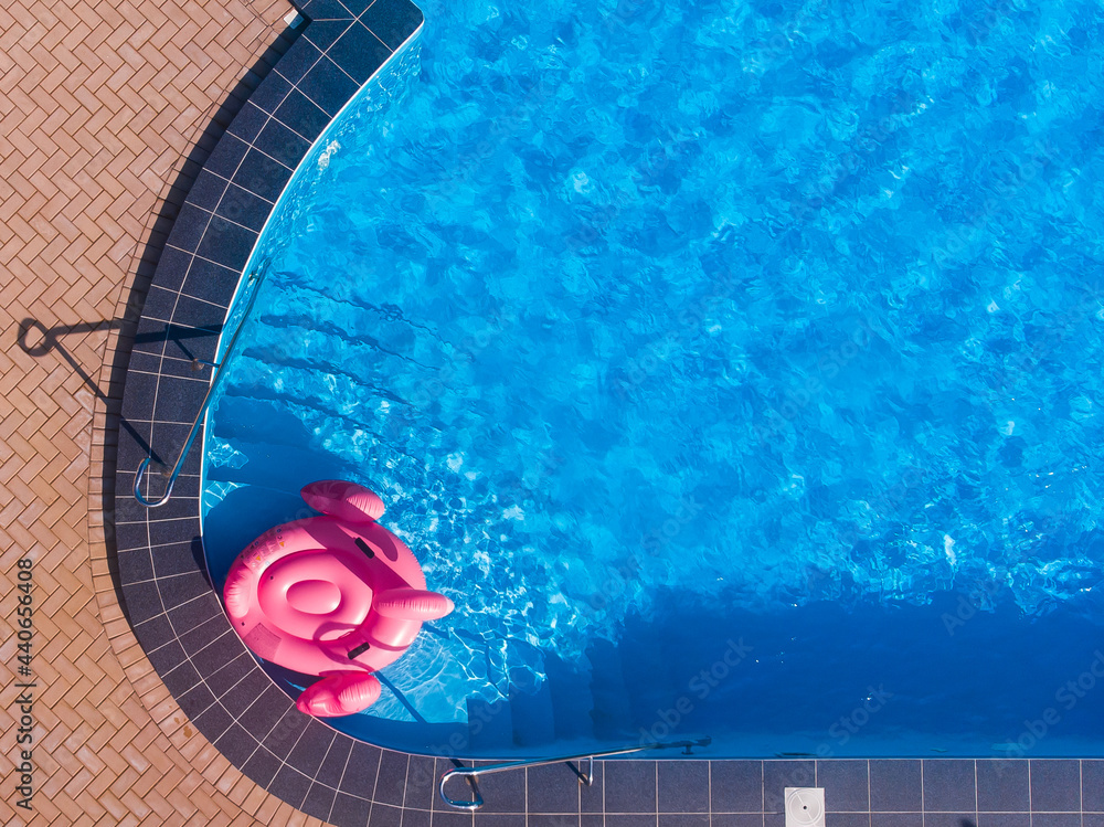 Unicorn flamingo float in blue water background, inflatable swim tube ...