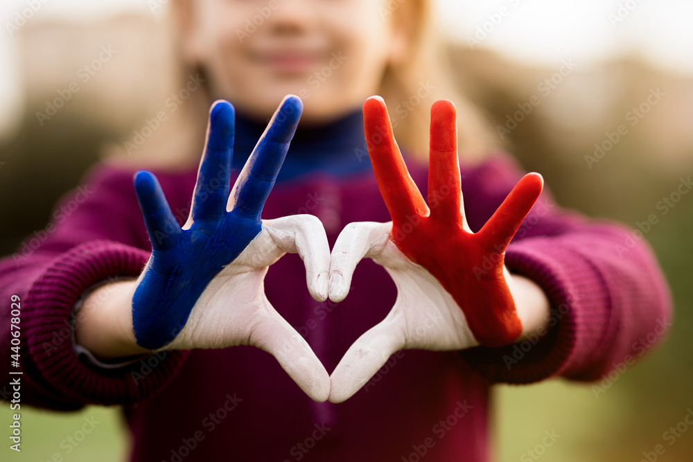 Love and happiness concept. Cute child forming heart gesture with hands ...