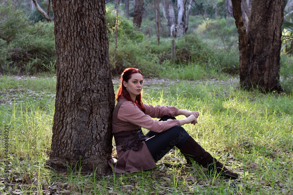 portrait of red haired girl wearing fantasy medieval clothes of a ...