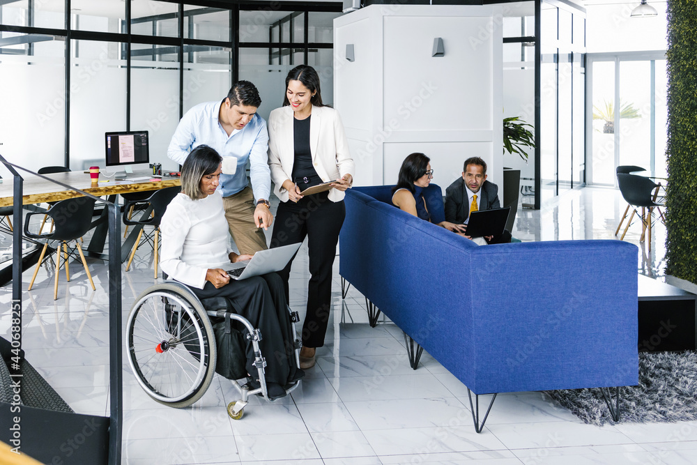 Mexican transgender woman in wheelchair presenting business strategy on ...
