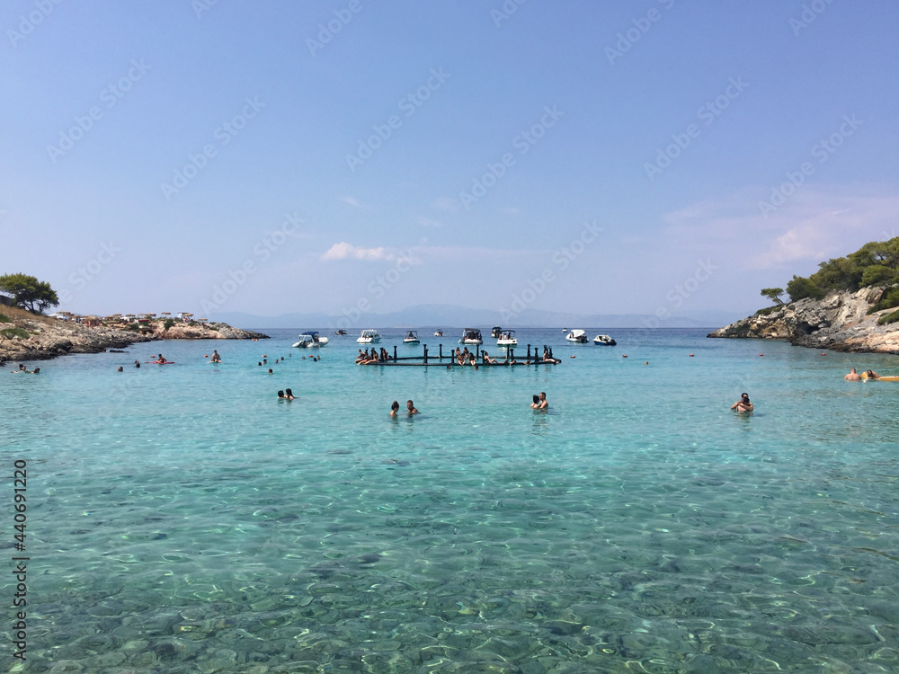 Aponisos beach, a pebble beach in a small cove with sheltered swimming ...