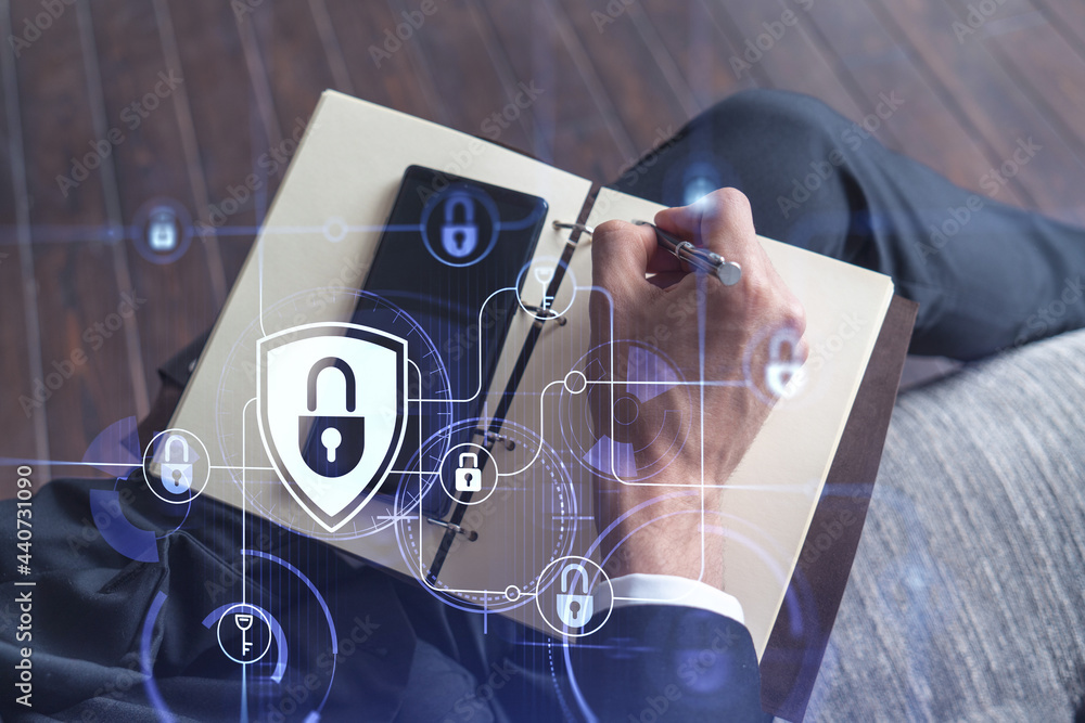 Programmer is taking notes of clients needs to protect cyber security ...