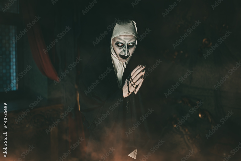 praying evil nun Stock Photo | Adobe Stock