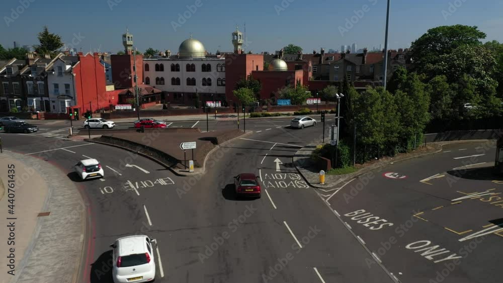 Car driving on Lea bridge roundabout, Madina Mosque Trust building ...