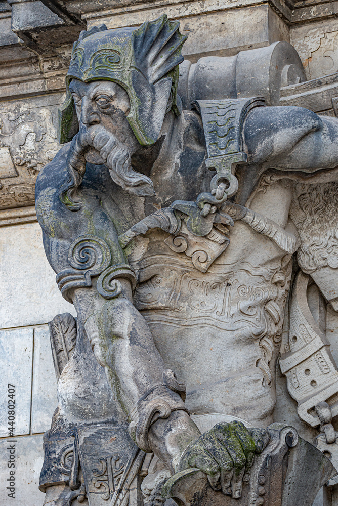 Ancient statute of scary, fearfull and heavy armed gatekeeper, medieval ...
