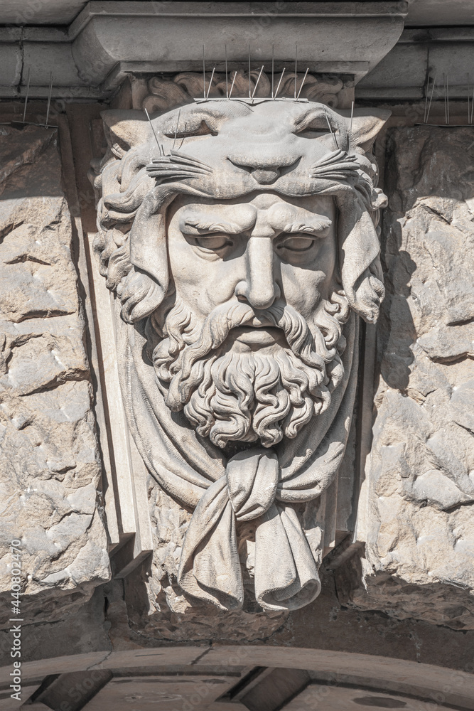 Bas-relief of an old sculpture of scary mythical worrier with leopard ...