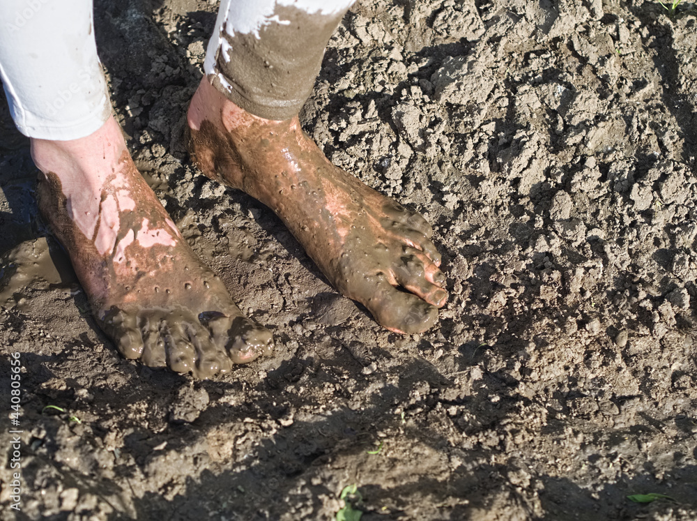 Muddy Feet of a Young Woman Stock Photo | Adobe Stock