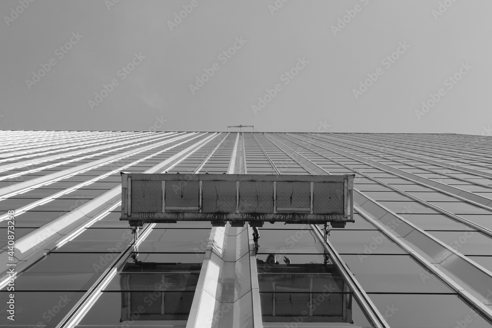 Black and white window washer cleaning a high building Stock Photo ...