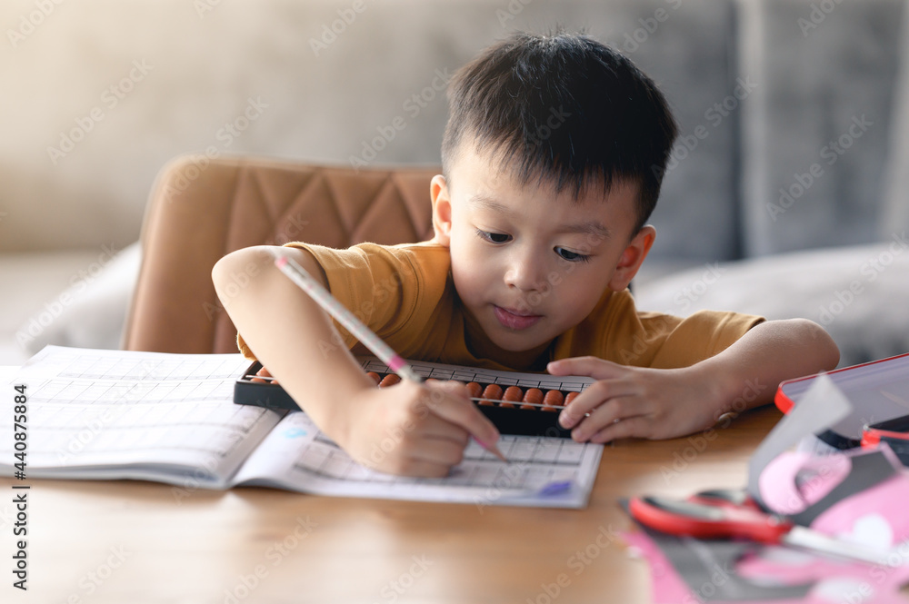 Asian boy Learning math with an abacus, education concept, home school ...