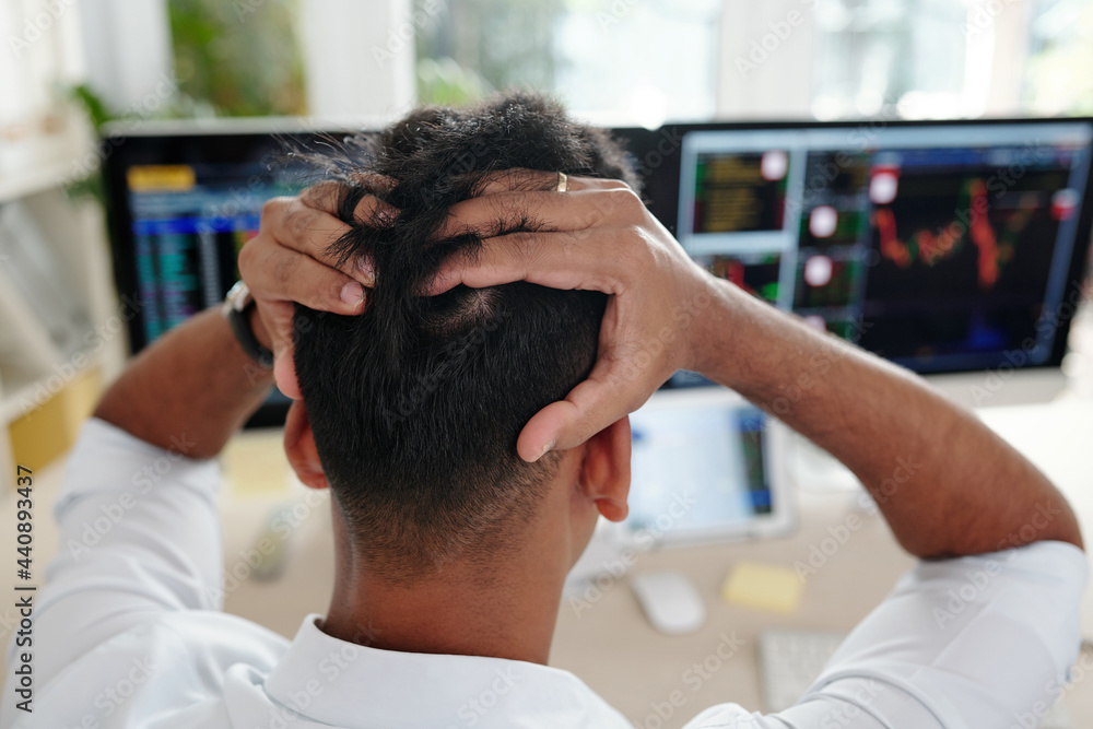 Stock trader tearing out his hair in frustration after loosing money of ...